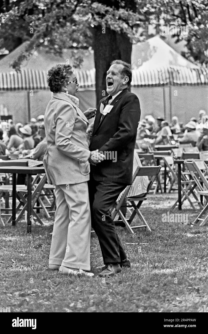 Two alumni of Tufts University in Medford, MA, share a laugh at an ...