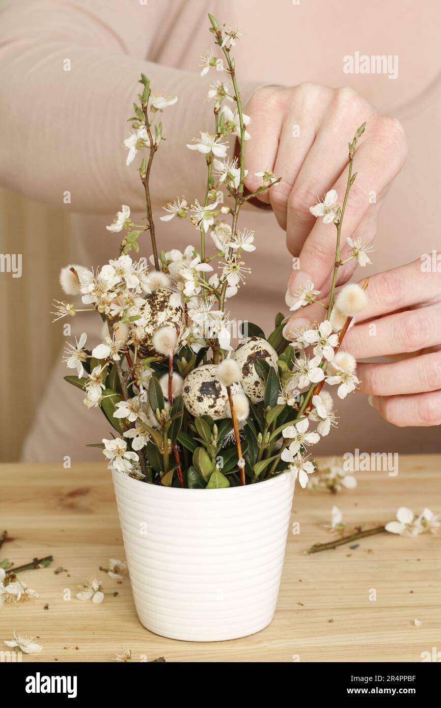 Florist at work: woman shows how to make simple decoration for Easter ...