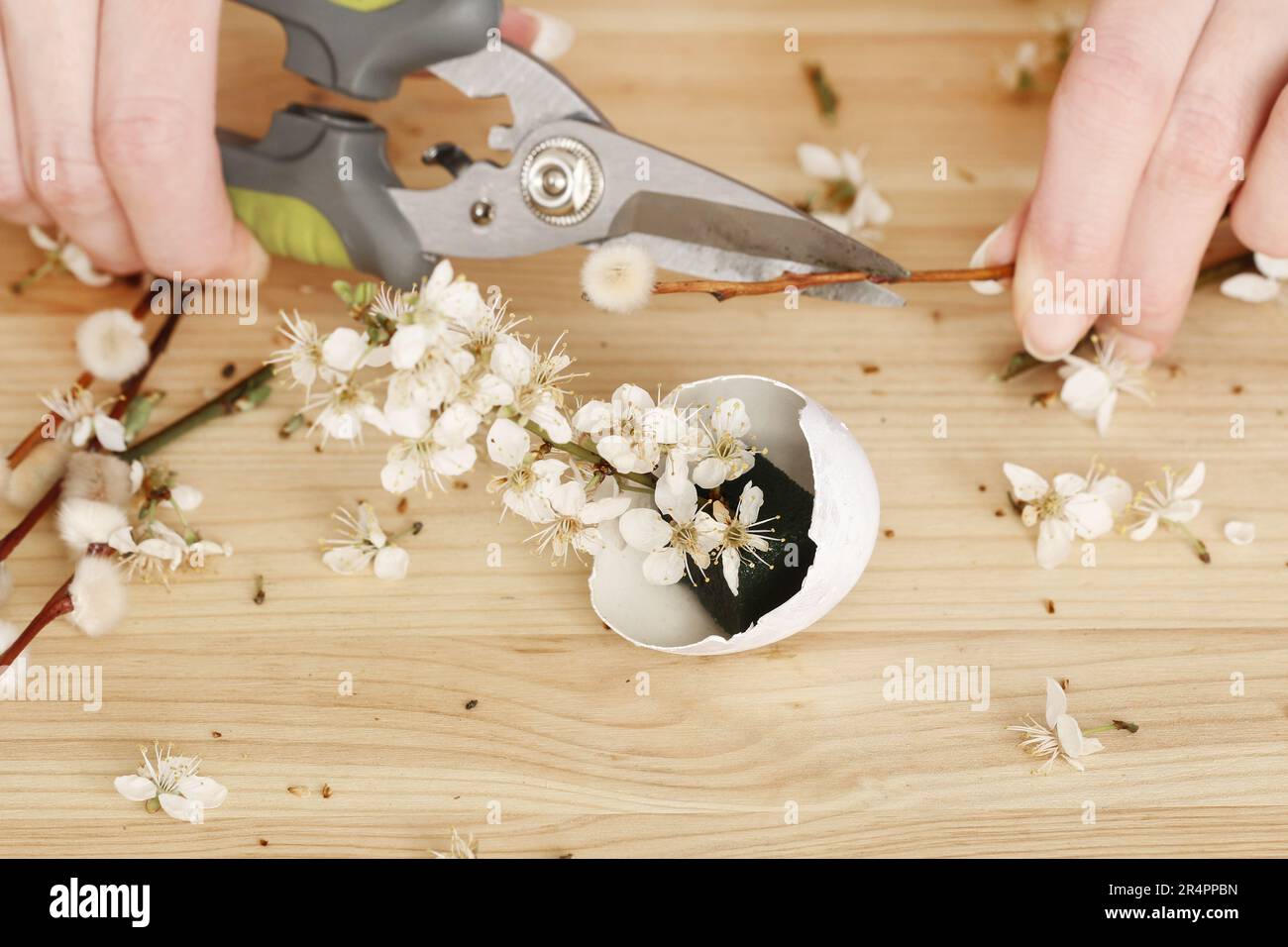 Florist at work: woman shows how to make simple decoration for Easter ...