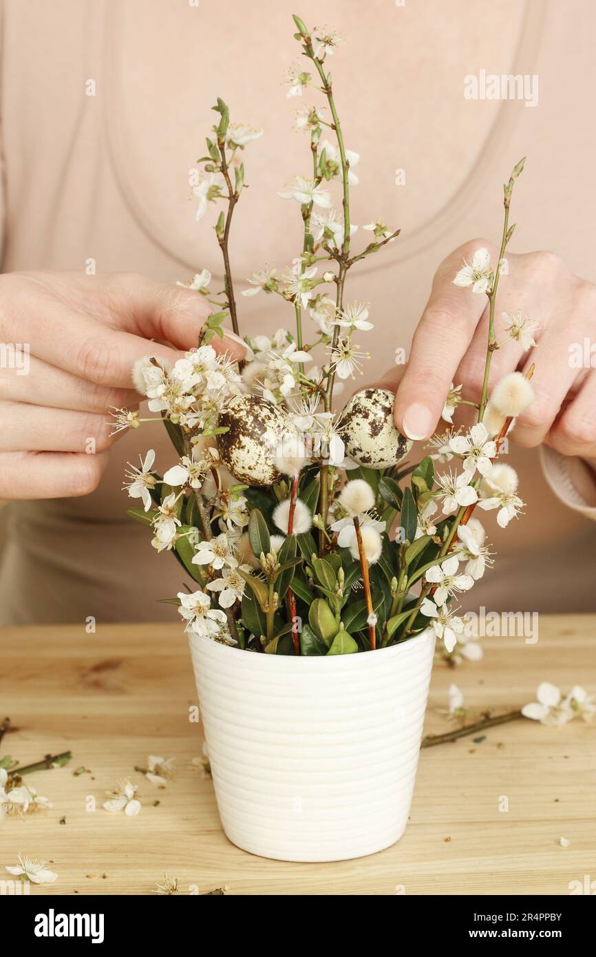 Florist at work: woman shows how to make simple decoration for Easter ...