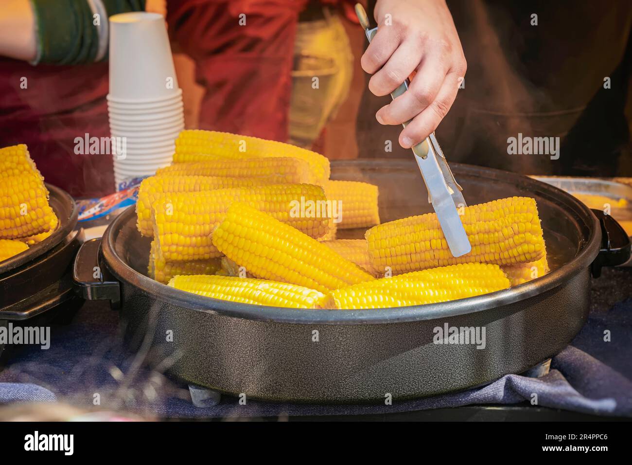 Pile of corn cobs for grill cooking and for sale, street diet fast food ...