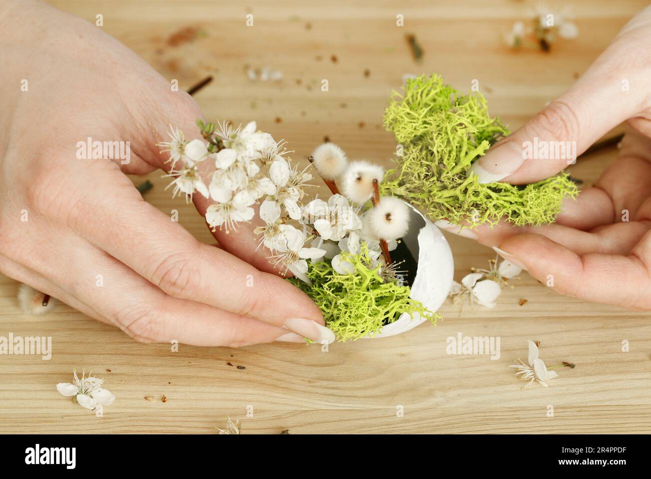 Florist at work: woman shows how to make simple decoration for Easter ...
