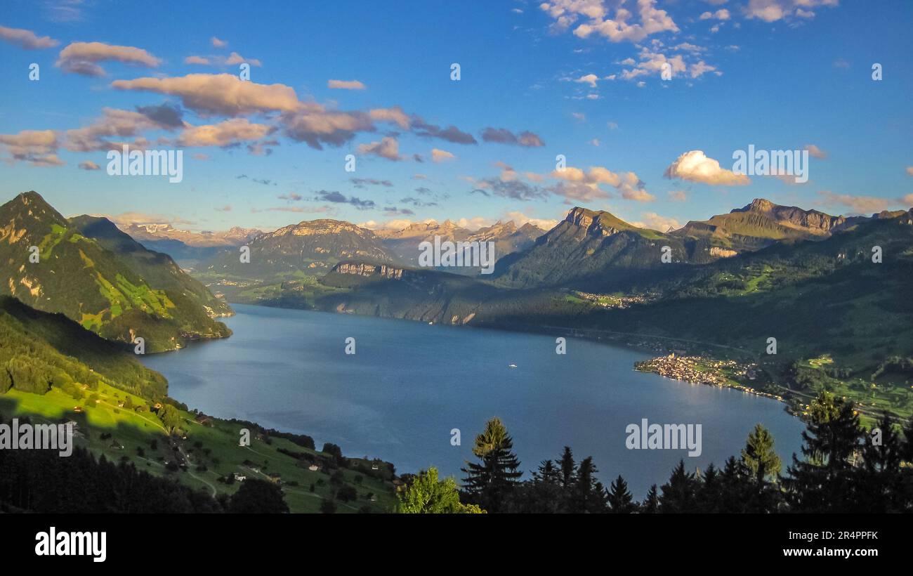 Scenic and beautiful mountain view with clouds overlooking Lake Luzerne (locally known as ...