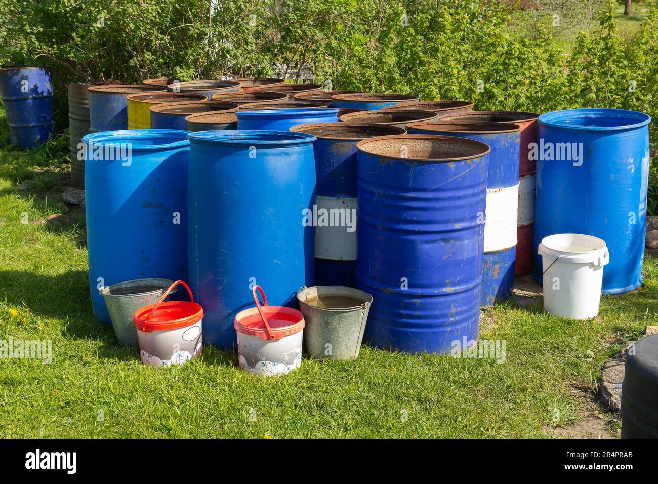 Metal water barrels Stock Photo - Alamy