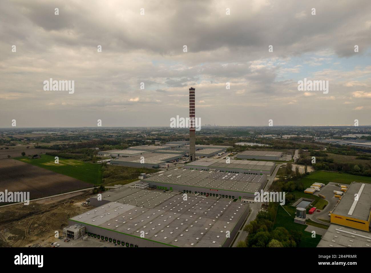 Warehouse halls, logistics, black clouds, aerial photo, chimney, CHP ...