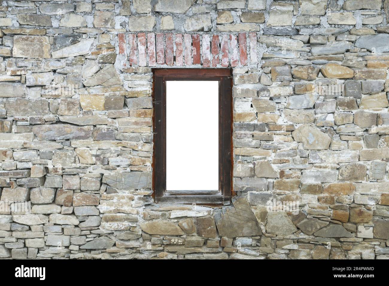A window with blank space on a stone facade of a medieval castle ...