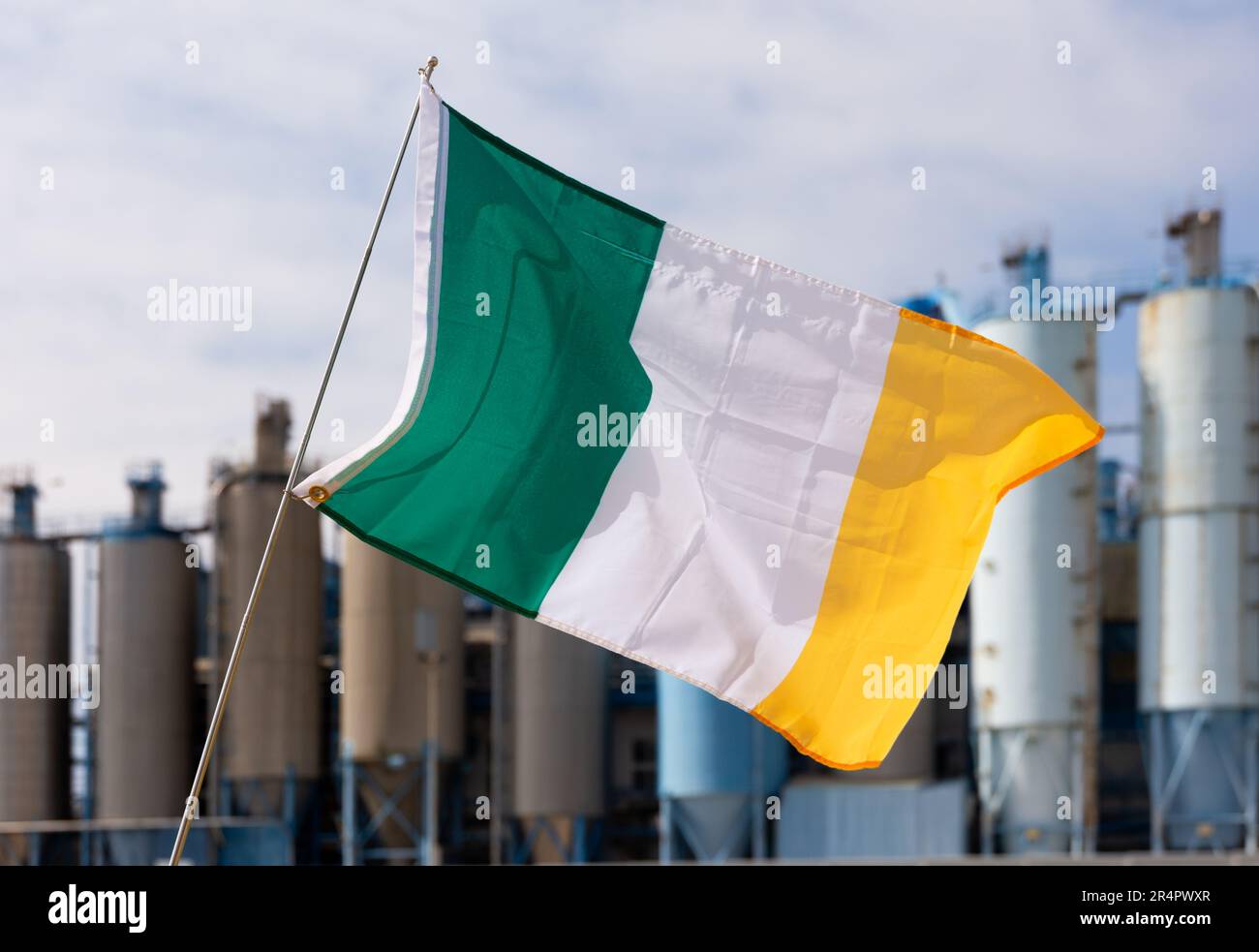 Flag of ireland flying with pride in front of industrial scenery Stock ...