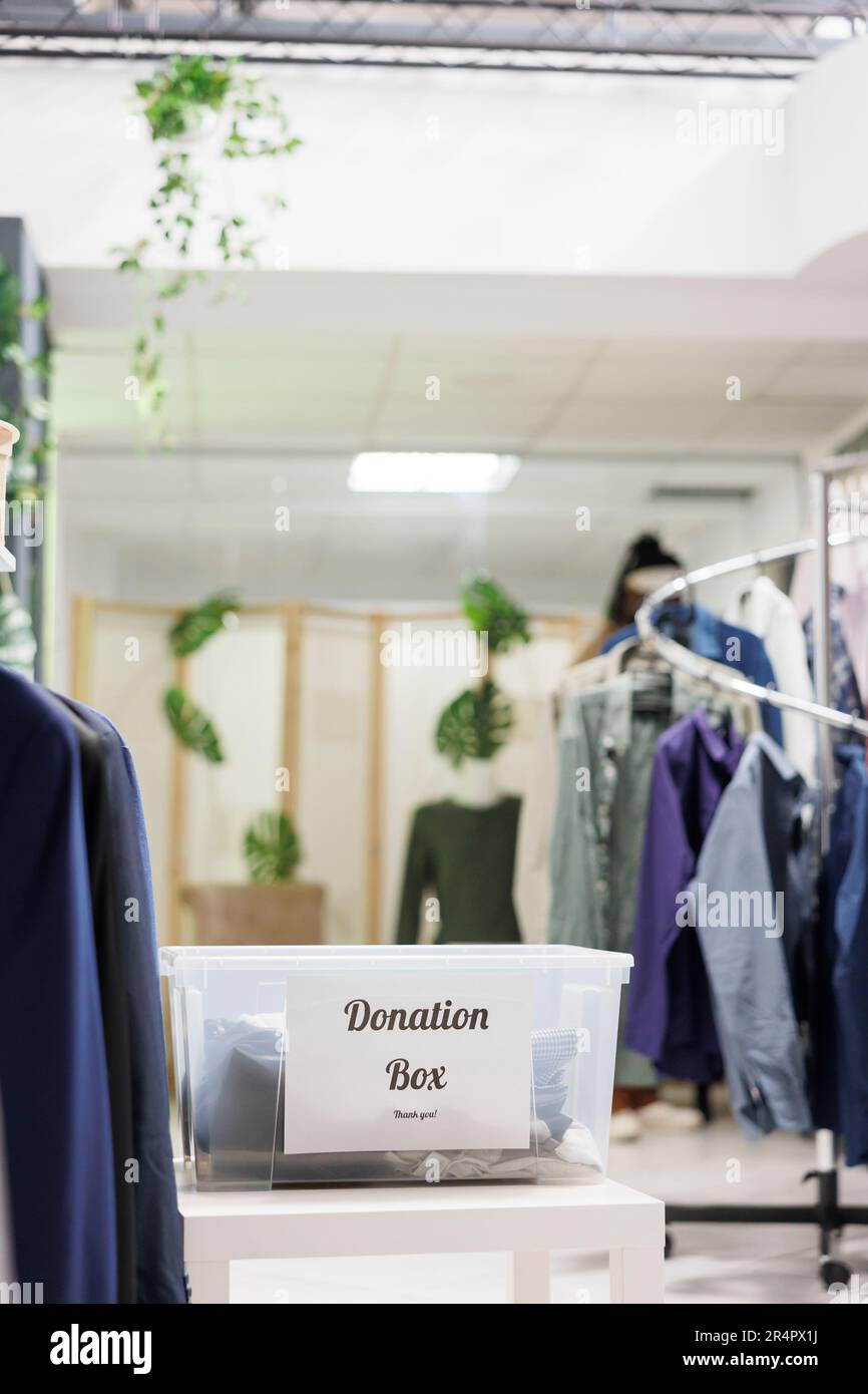 Second hand clothes in donation box in shopping center Stock Photo - Alamy