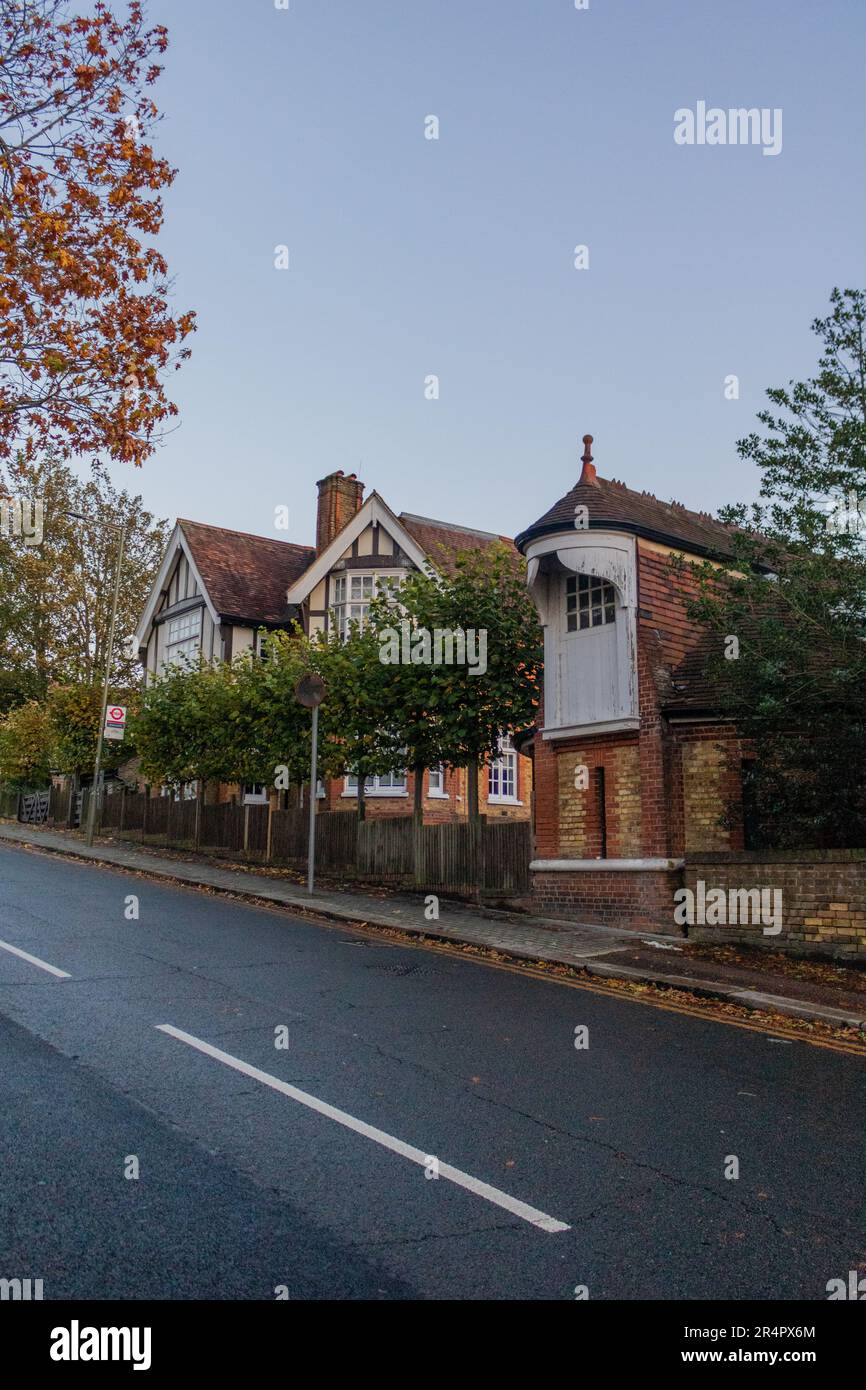 British authentic architecture. Brick house and road Stock Photo - Alamy