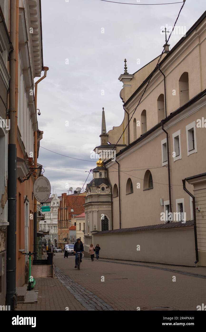 Street in old town Vilnius, Lithuania.Cloudy day pedestrians and ...