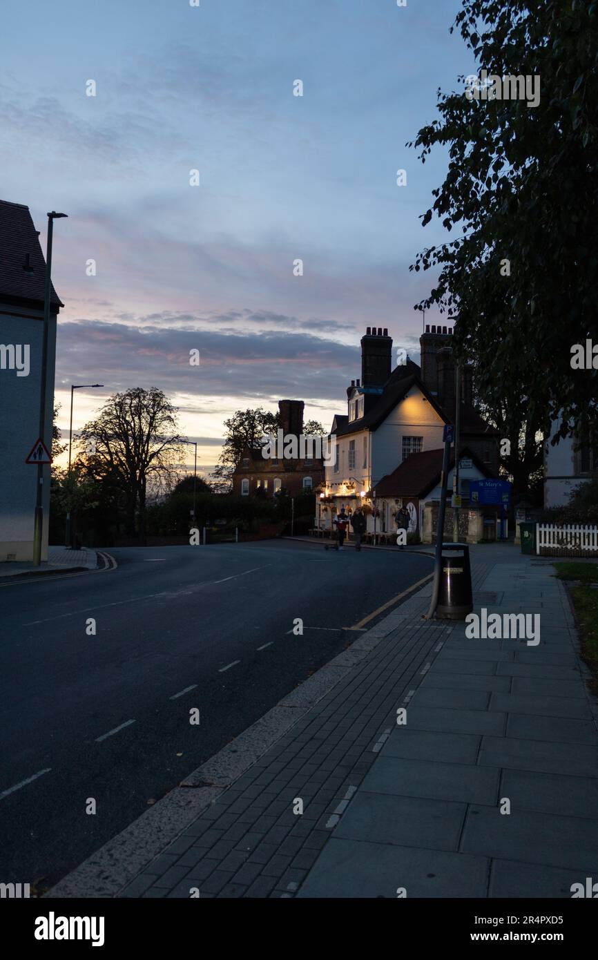 Traditional British pub, curved road and sunset Stock Photo - Alamy