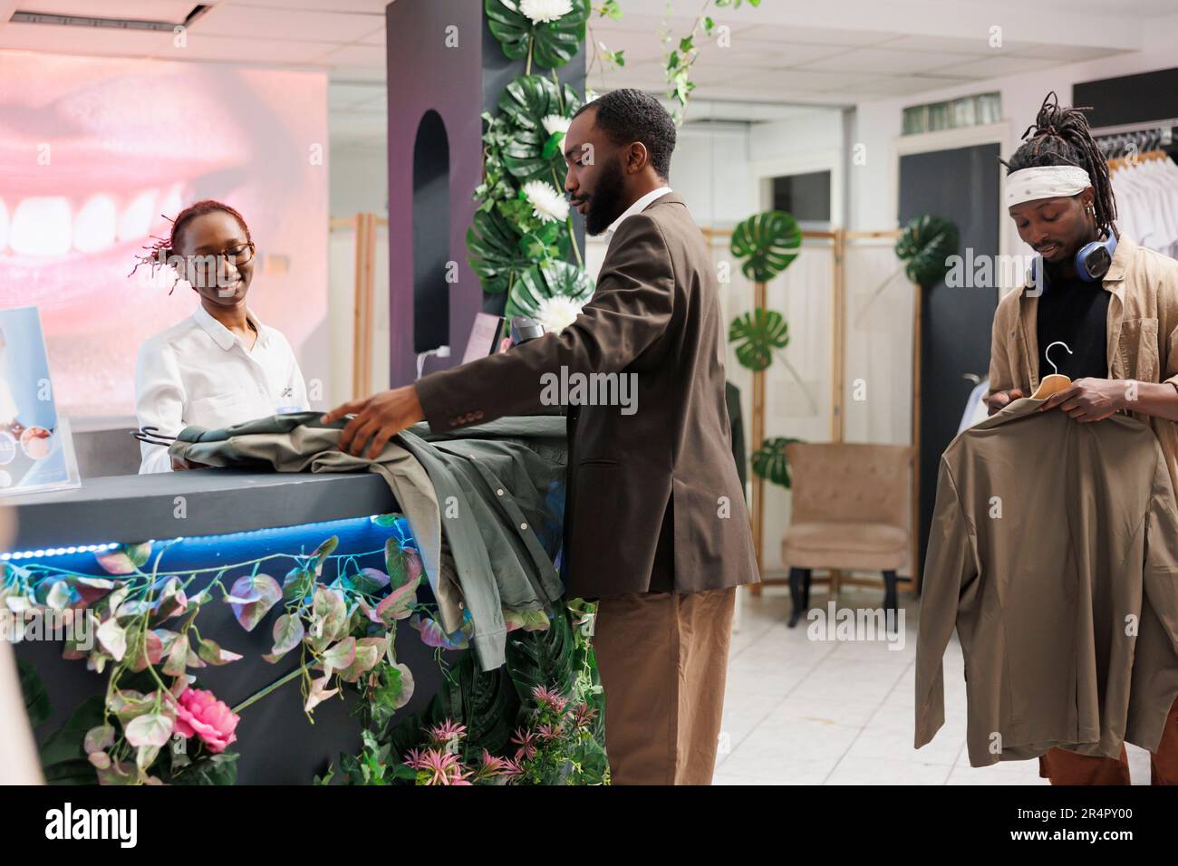 Putting on new shirts hi-res stock photography and images - Alamy