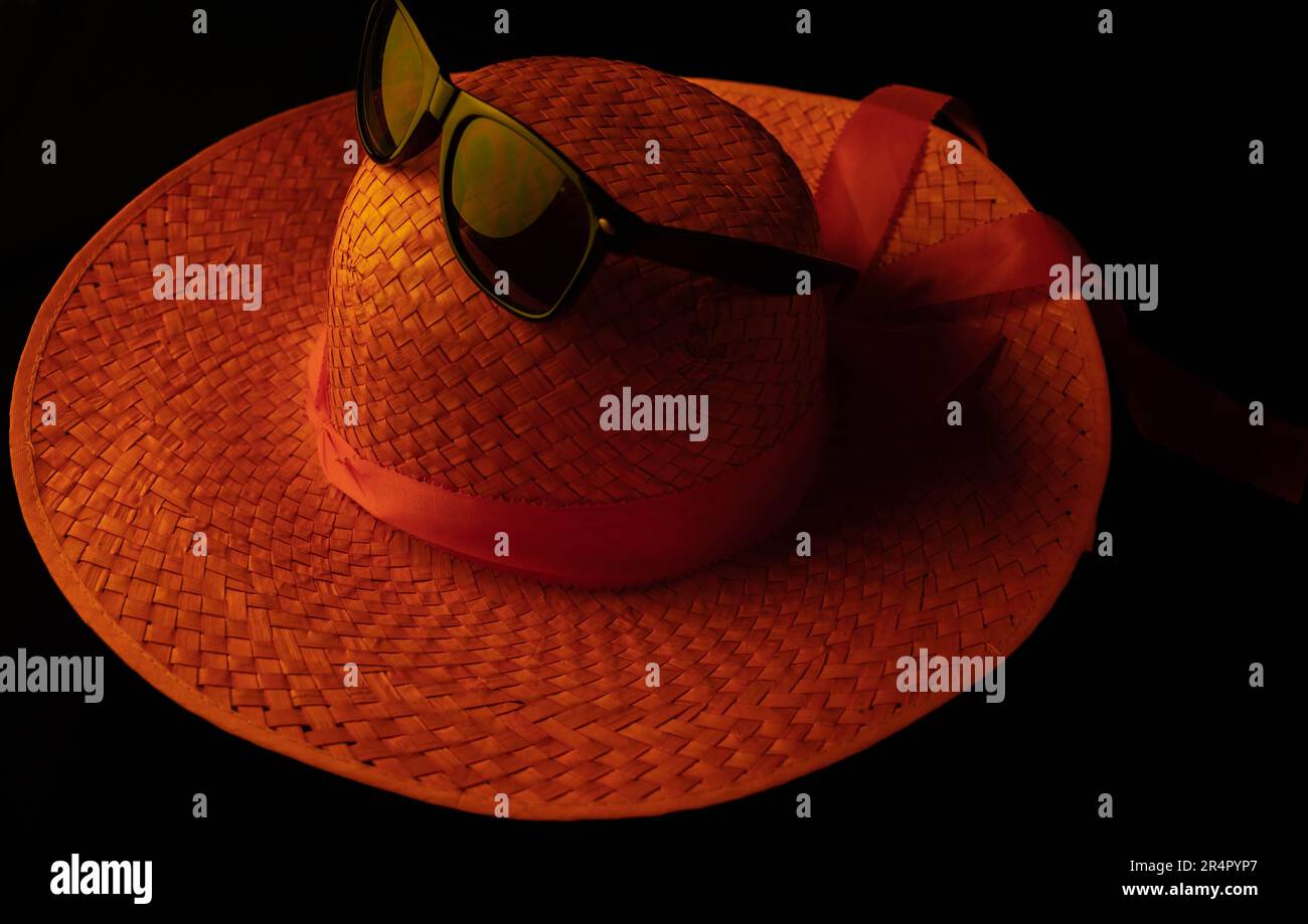 orange hat in black Stock Photo - Alamy