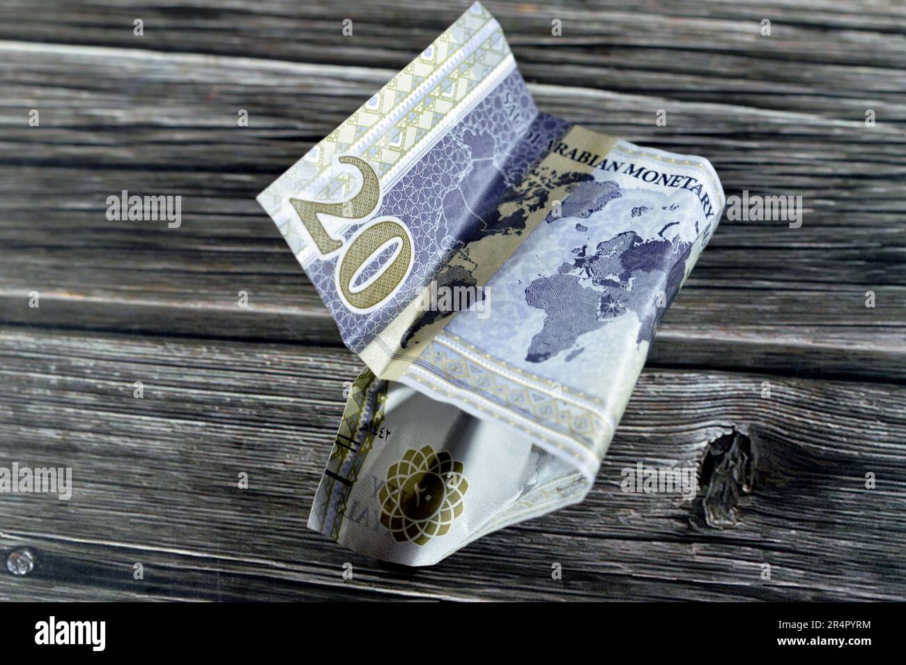 Crumpled Saudi Arabia money of 20 SAR twenty riyals with G20 summit ...