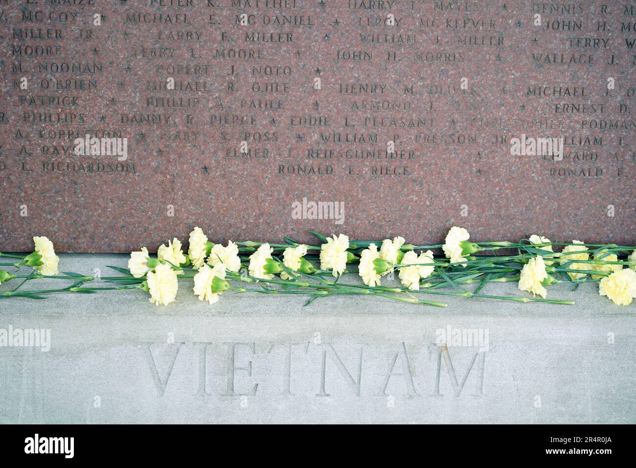 St. Louis, United States. 29th May, 2023. Flowers are placed on a ...