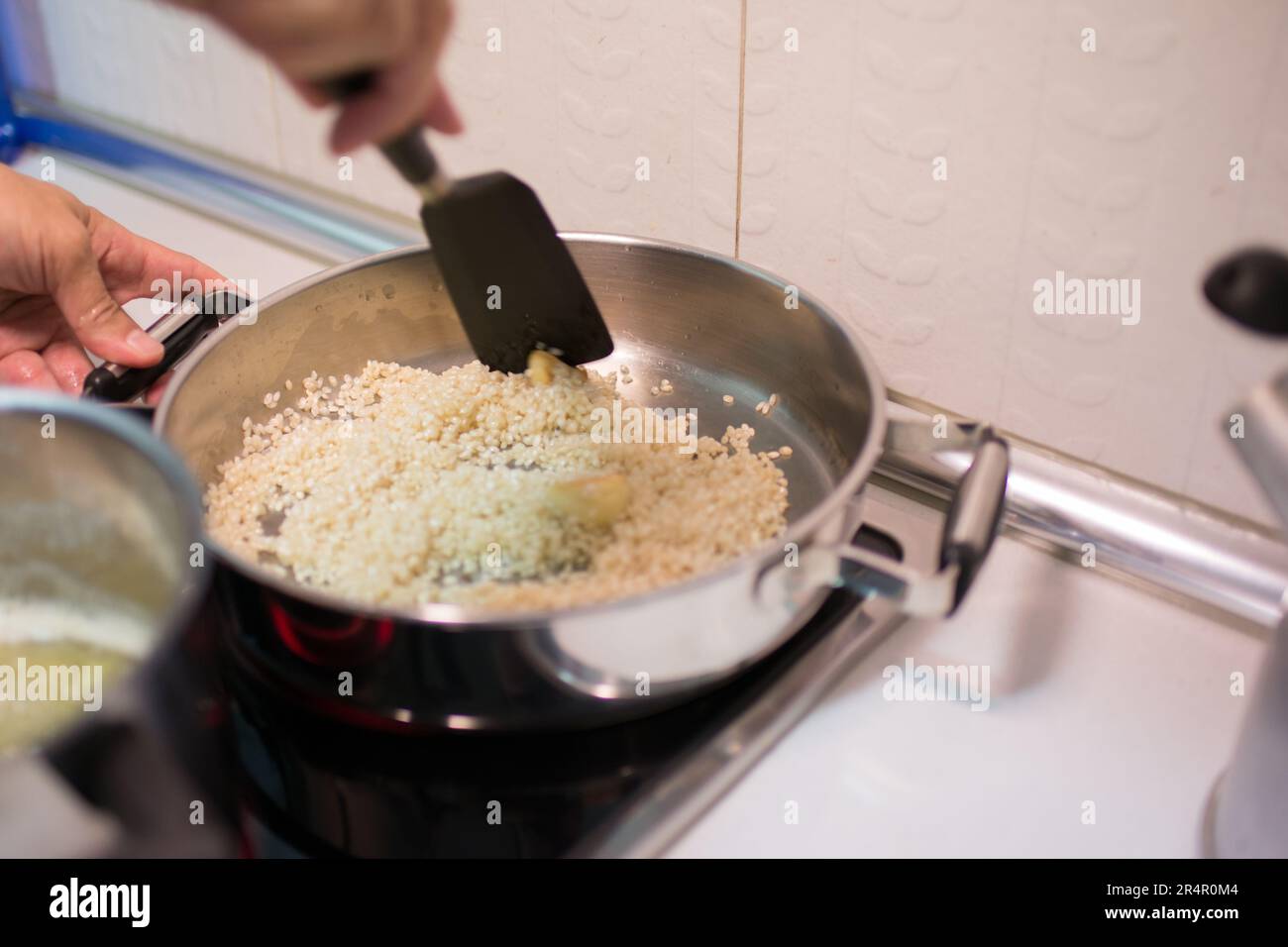 Kitchen hand cooking hi-res stock photography and images - Alamy