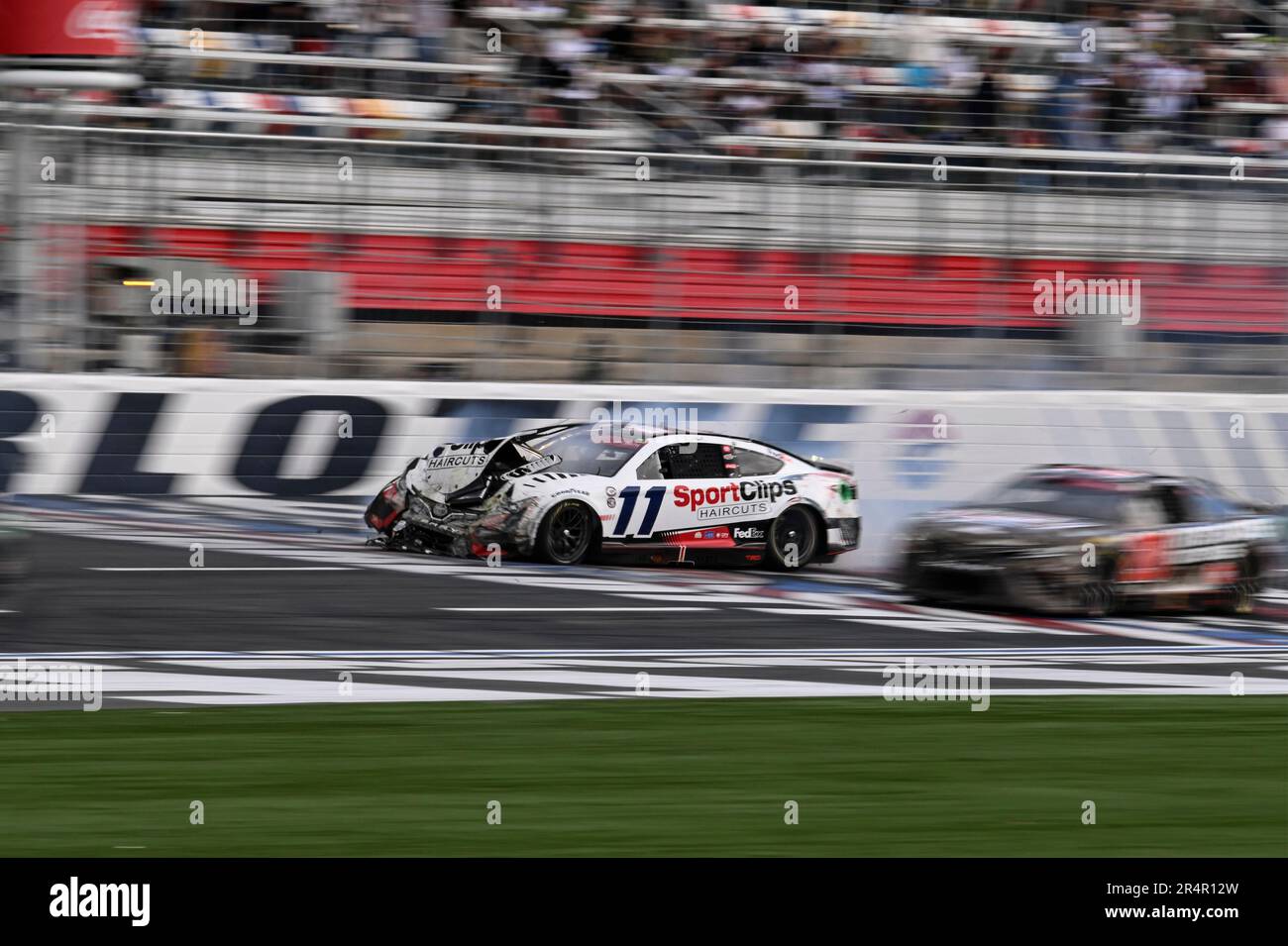 Denny Hamlin (11) crashes on the front stretch during a NASCAR Cup ...