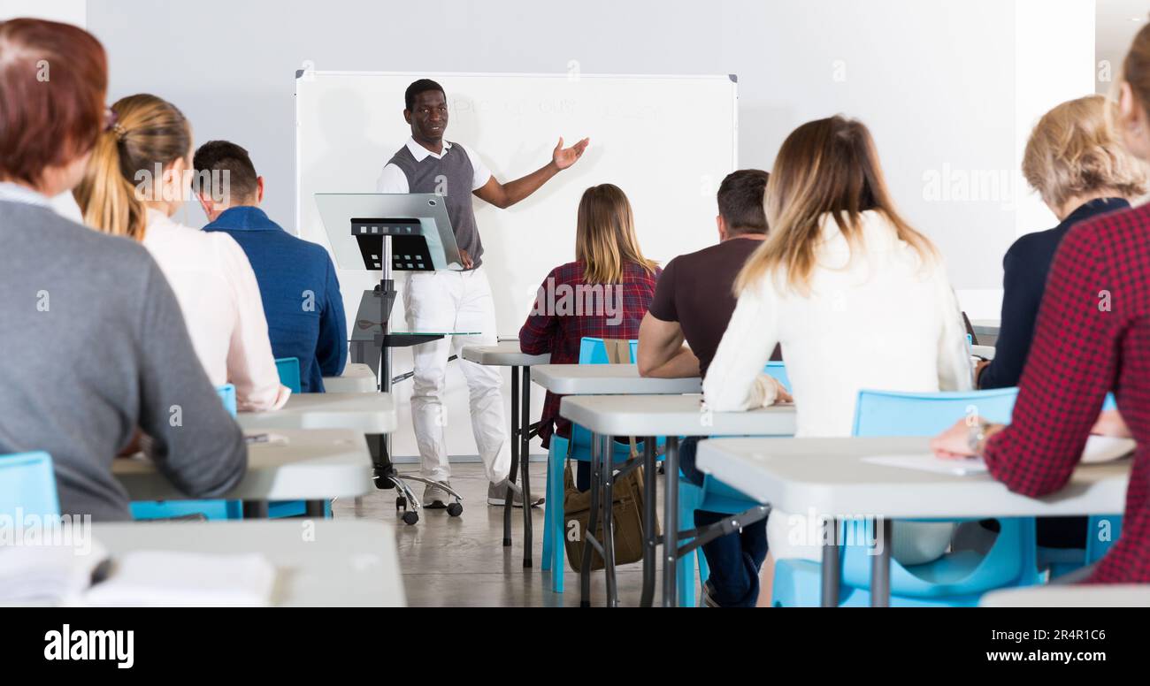 African American teacher giving presentation for students Stock Photo ...