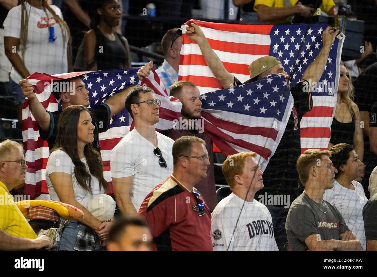 Fans show their respect for the fallen during the Arizona Diamondbacks ...