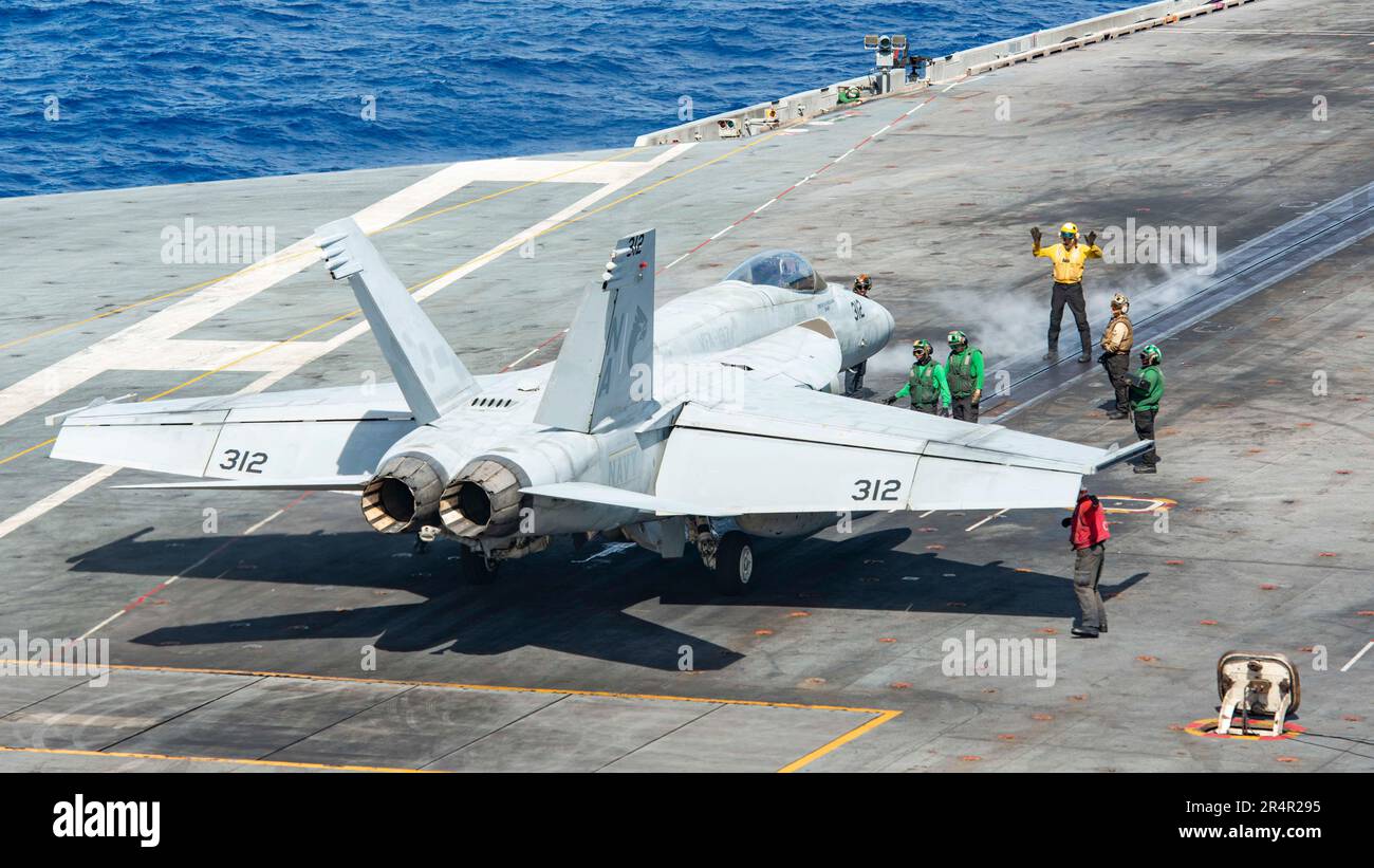 230528-N-NX635-1086 PACIFIC OCEAN (May 28, 2023) A U.S. Navy Sailor directs an E-2C Hawkeye from ...