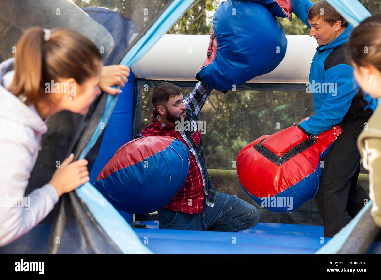 Men boxing on inflatable ring Stock Photo - Alamy