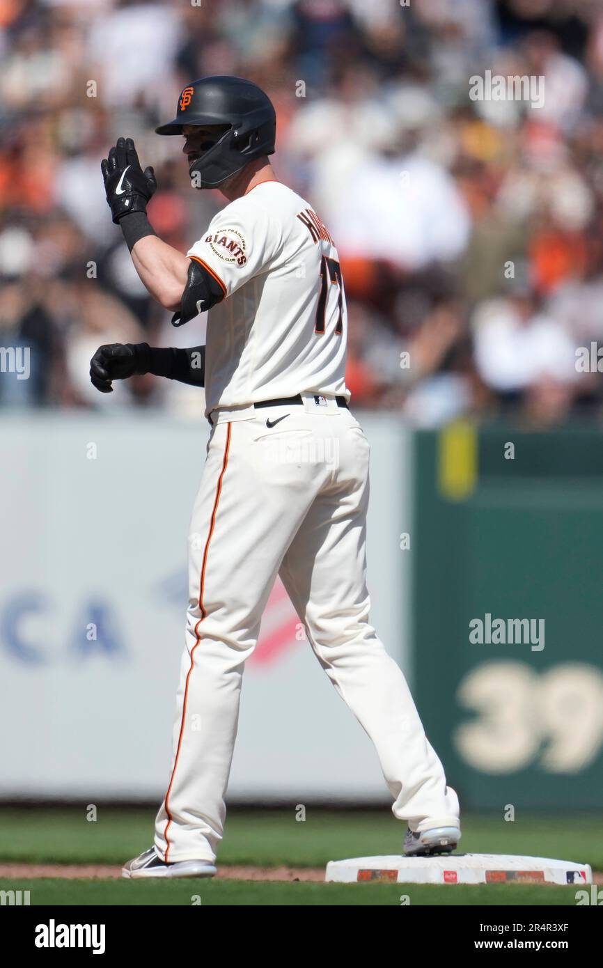 San Francisco Giants' Mitch Haniger gestures toward teammates after ...