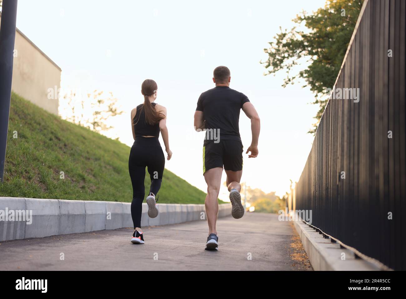 Back view couple in sportswear hi-res stock photography and images - Alamy