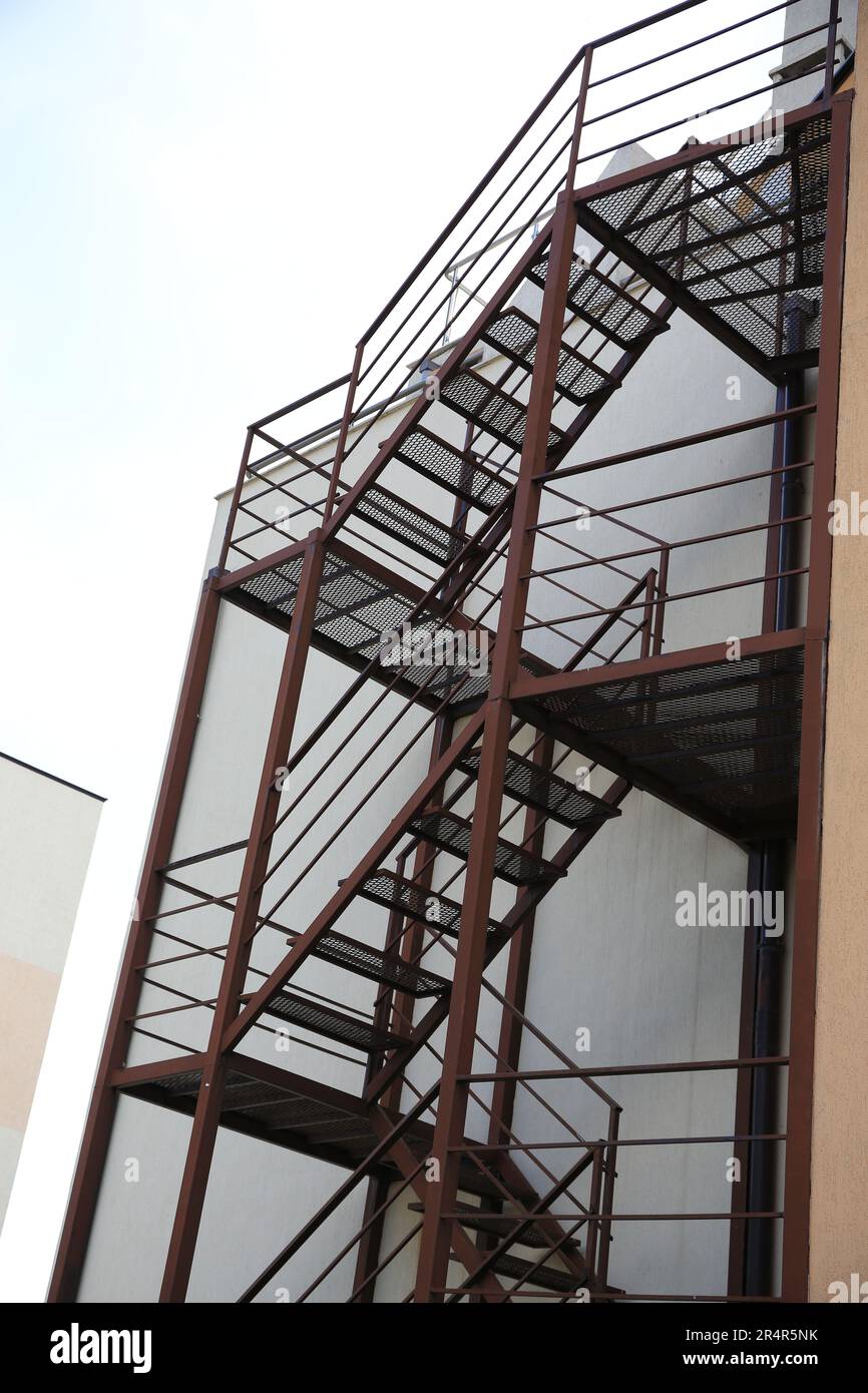 Metal fire escape ladder near building outdoors, low angle view Stock ...