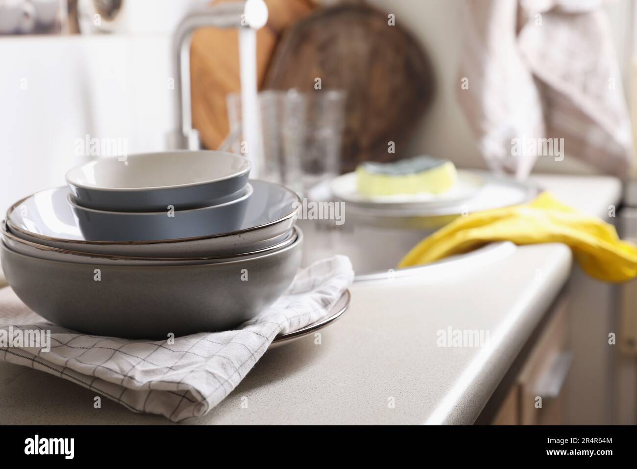 Clean bowls near kitchen sink. Washing dishes Stock Photo - Alamy