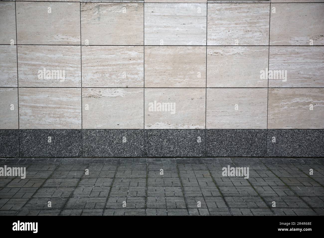 View on urban tiled wall and pavement Stock Photo - Alamy