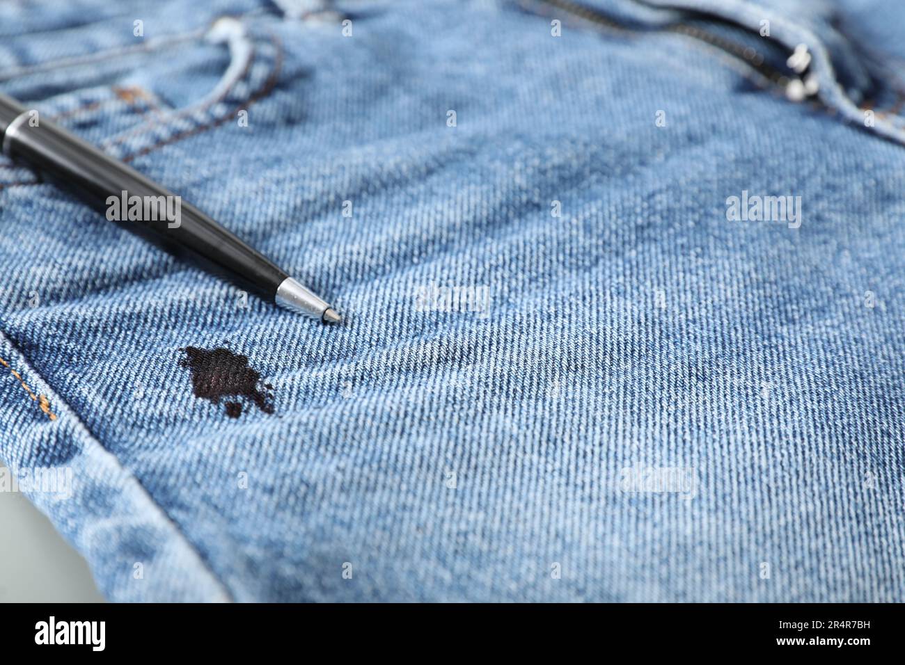 Pen and stain of black ink on jeans, closeup. Space for text Stock ...