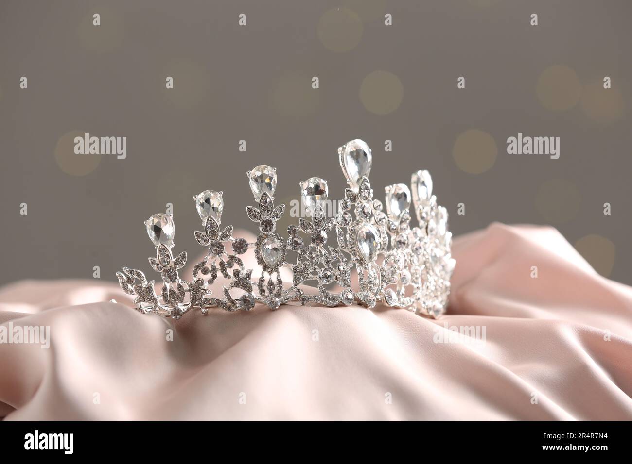 Beautiful silver tiara with diamonds on light cloth Stock Photo - Alamy