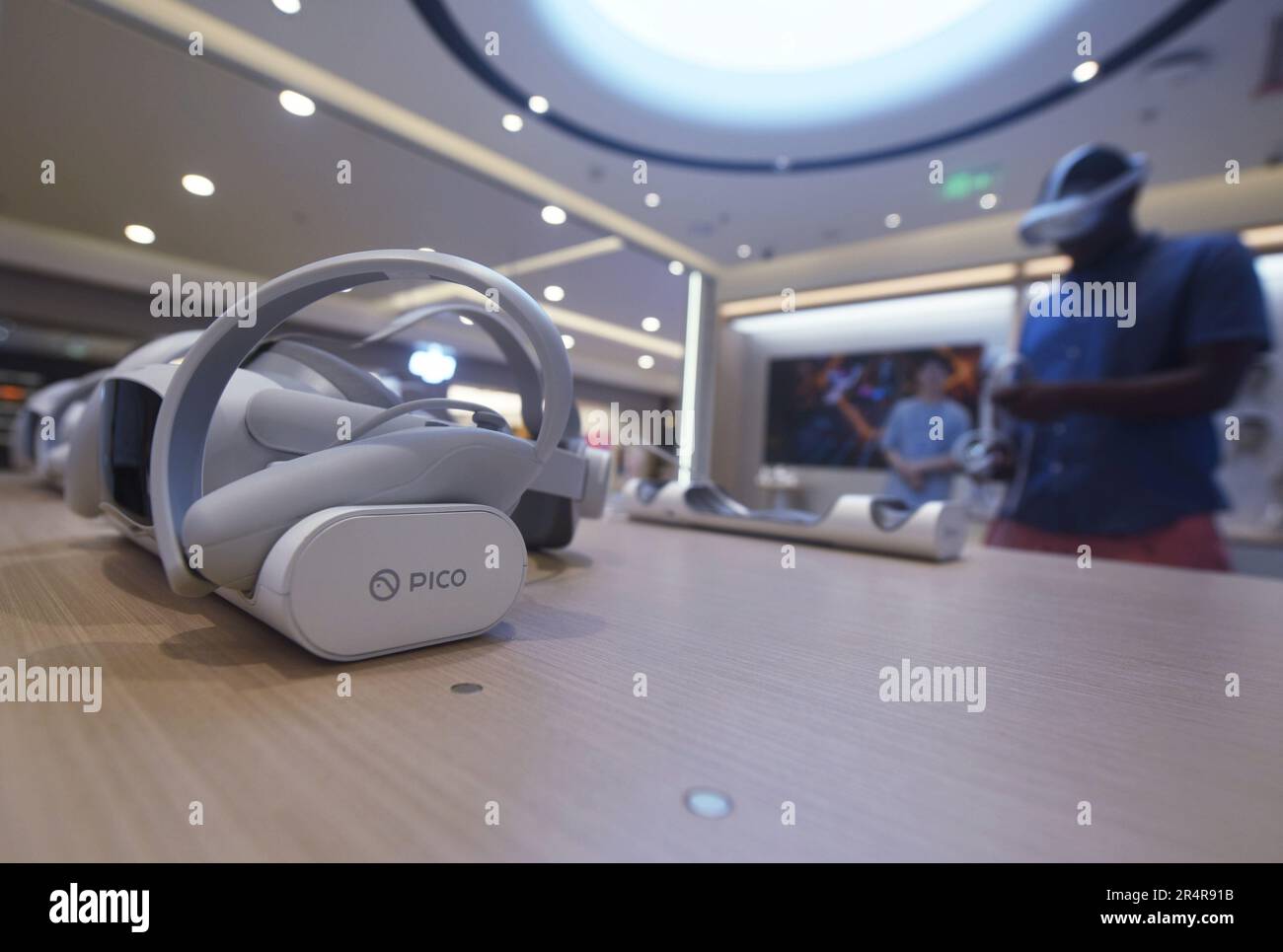 HANGZHOU, CHINA - MAY 29, 2023 - Customers experience VR glasses at a ByteDance PICO store in ...