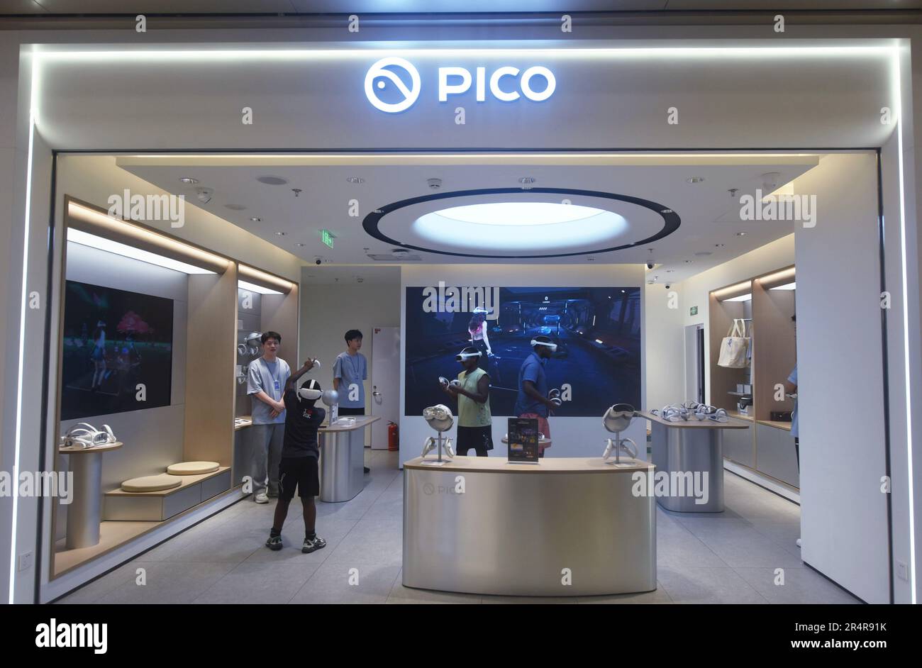 HANGZHOU, CHINA - MAY 29, 2023 - Customers experience VR glasses at a ...