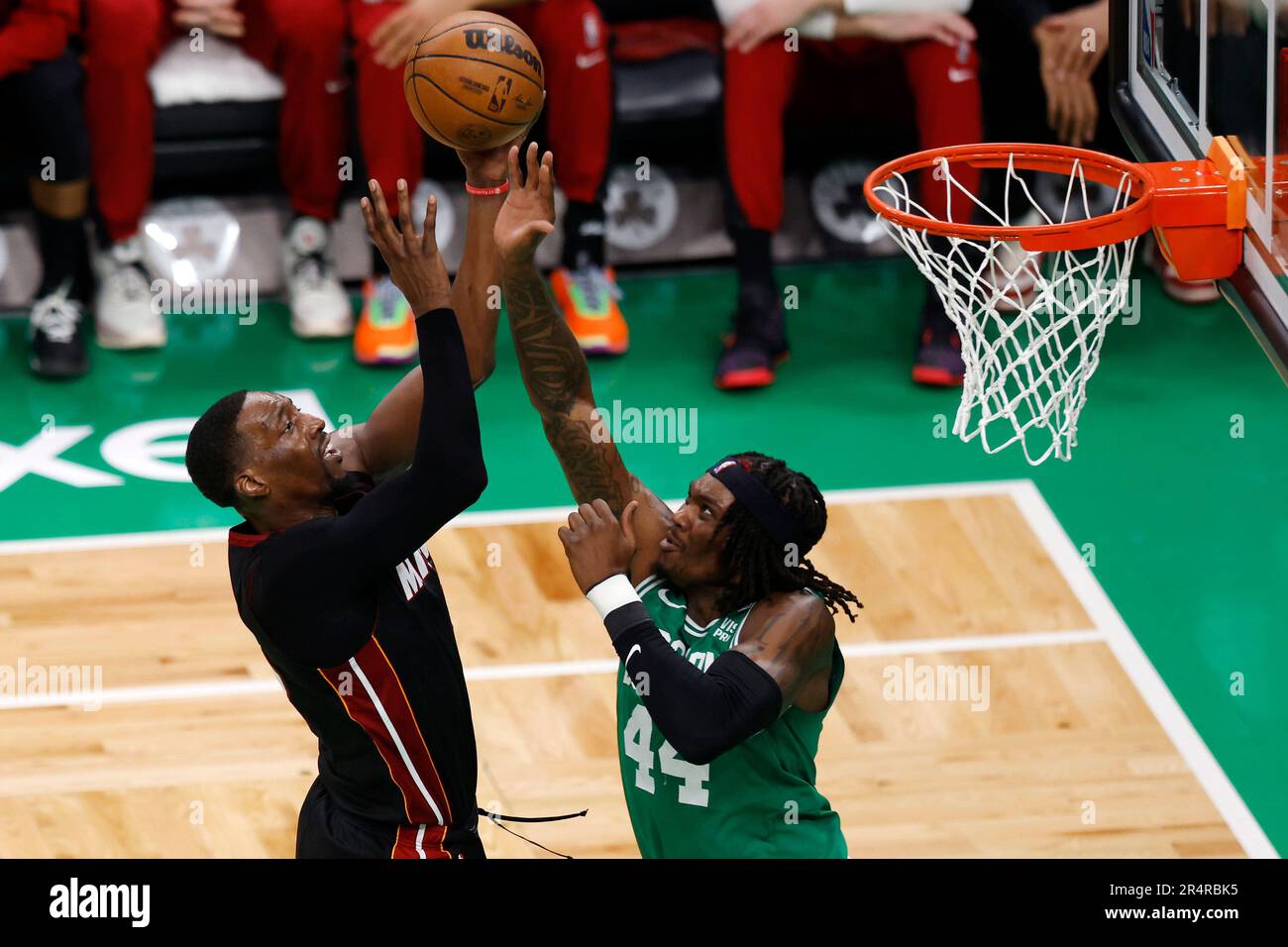 Miami Heat center Bam Adebayo, left, shoots as Boston Celtics center ...