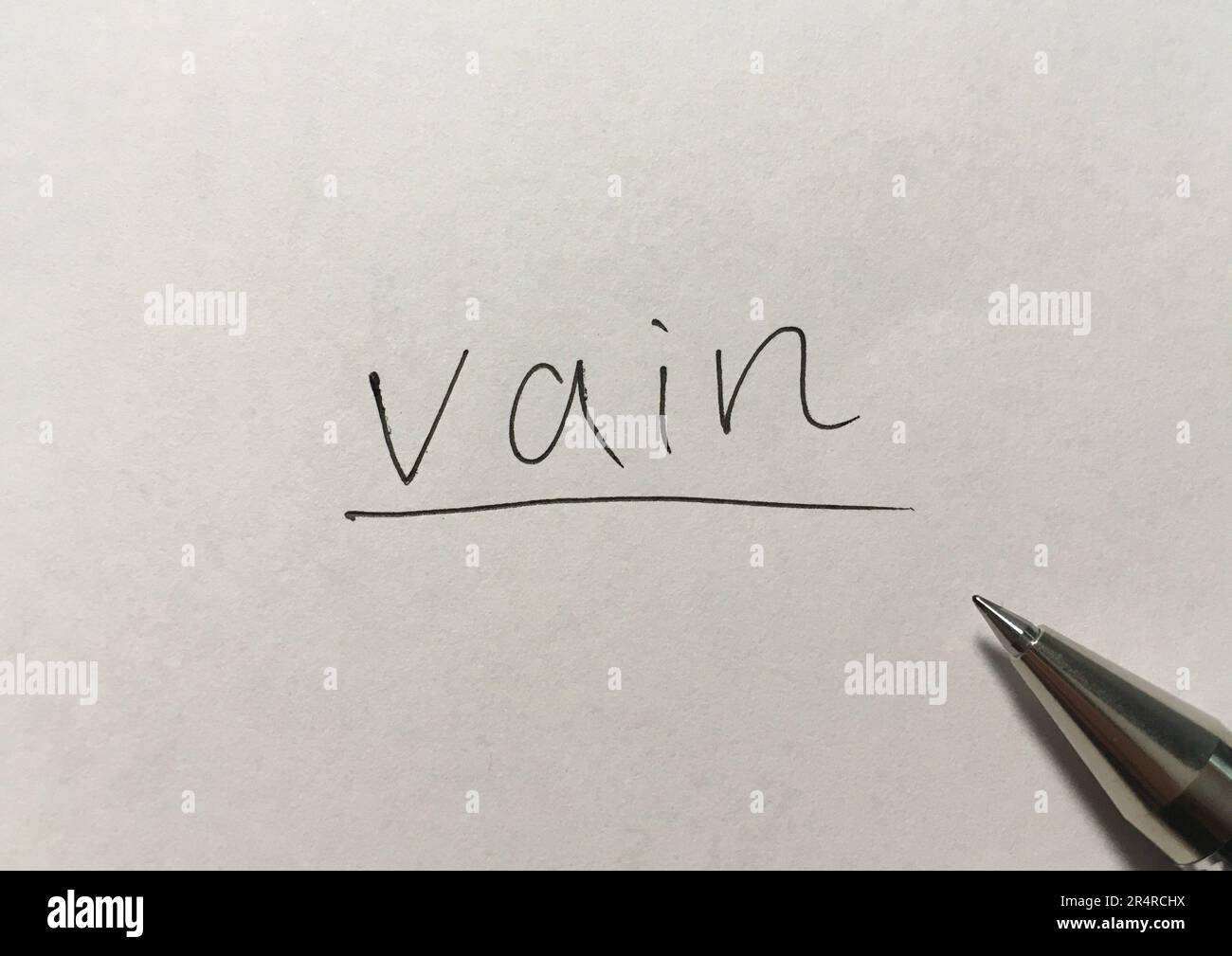 Vain concept word on paper background Stock Photo - Alamy