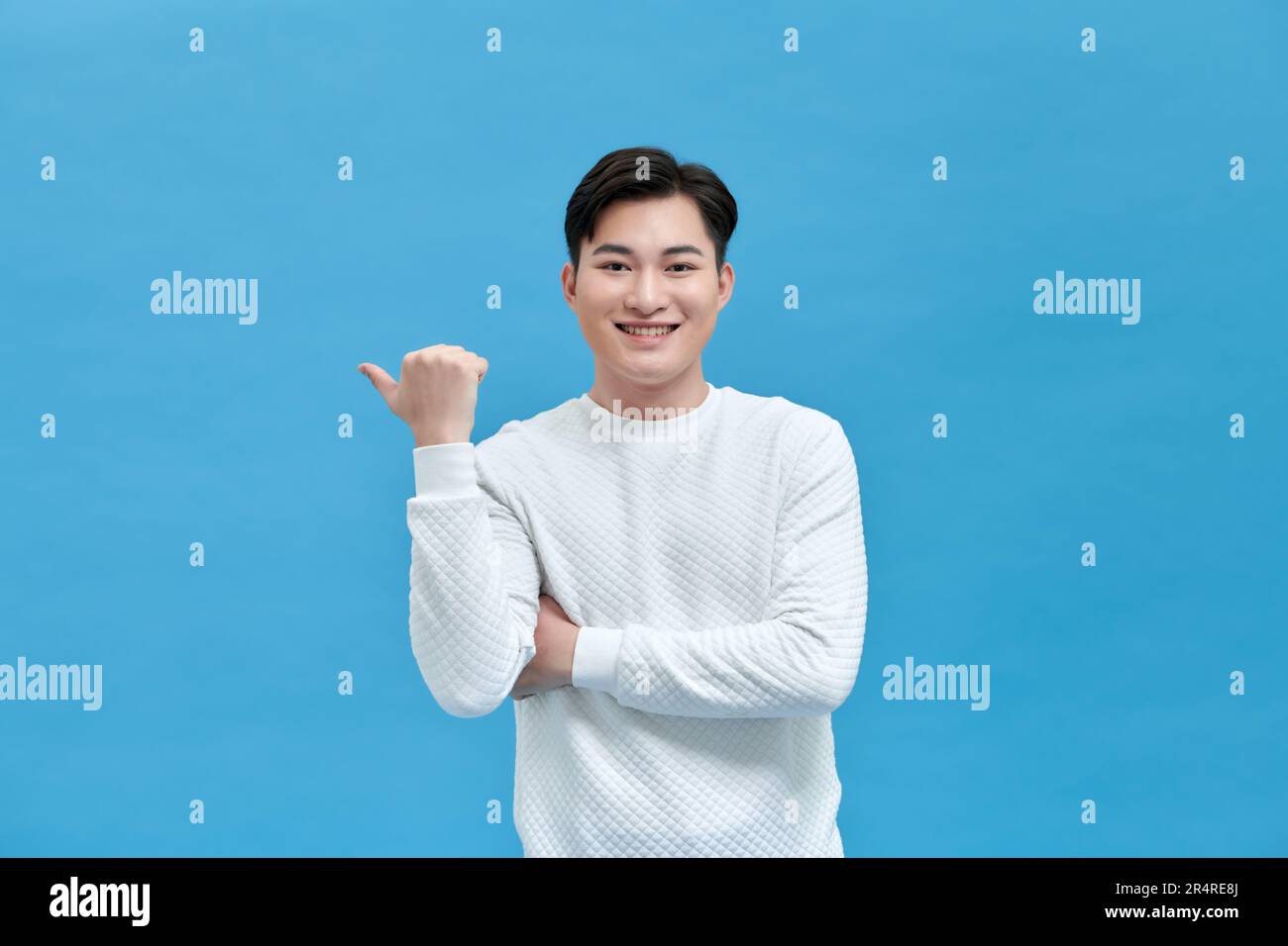 Portrait of cheerful attractive joyful confident guy hinting pointing ...