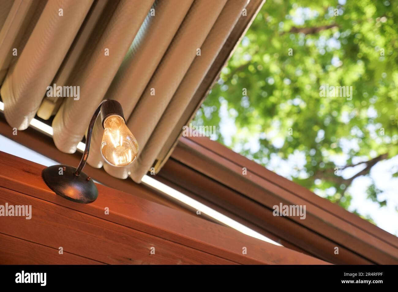 light bulb on celling at home with open roof Stock Photo - Alamy