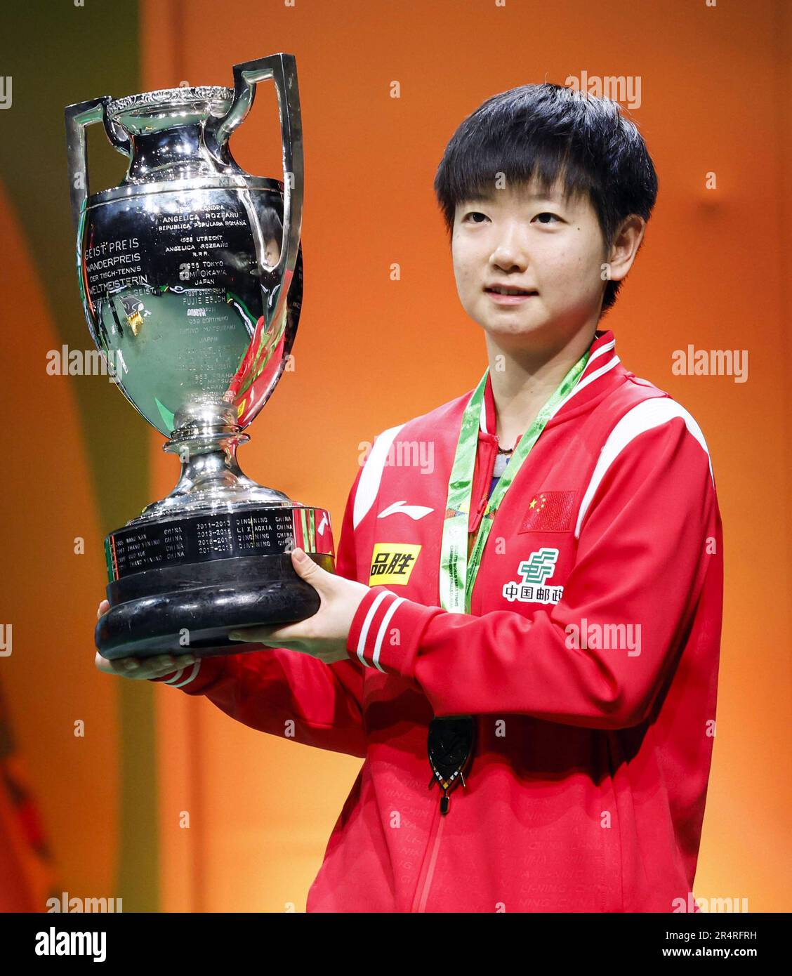 Sun Yingsha of China holds the victor's trophy after winning gold in ...