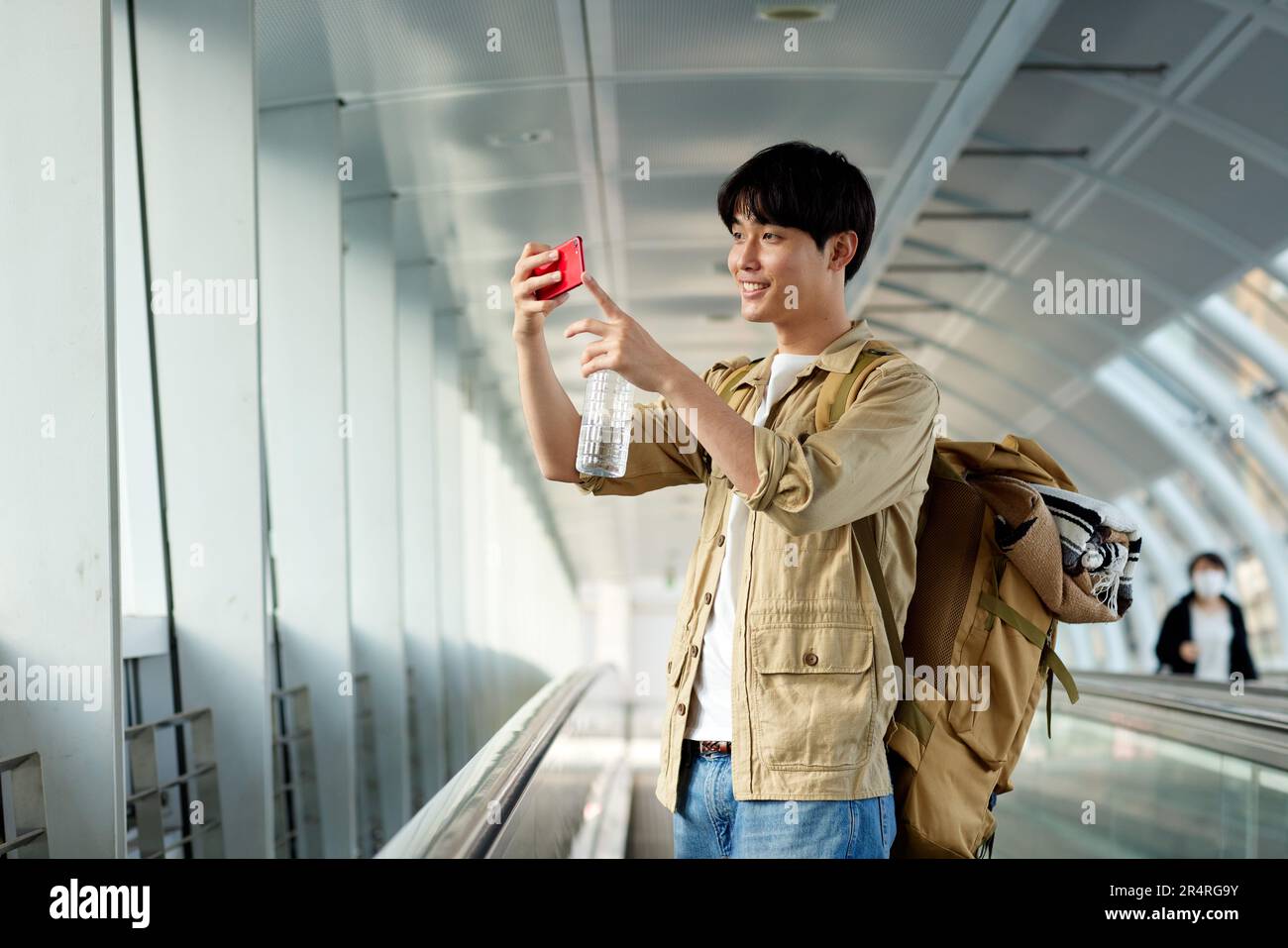 Young Japanese man travelling Stock Photo - Alamy