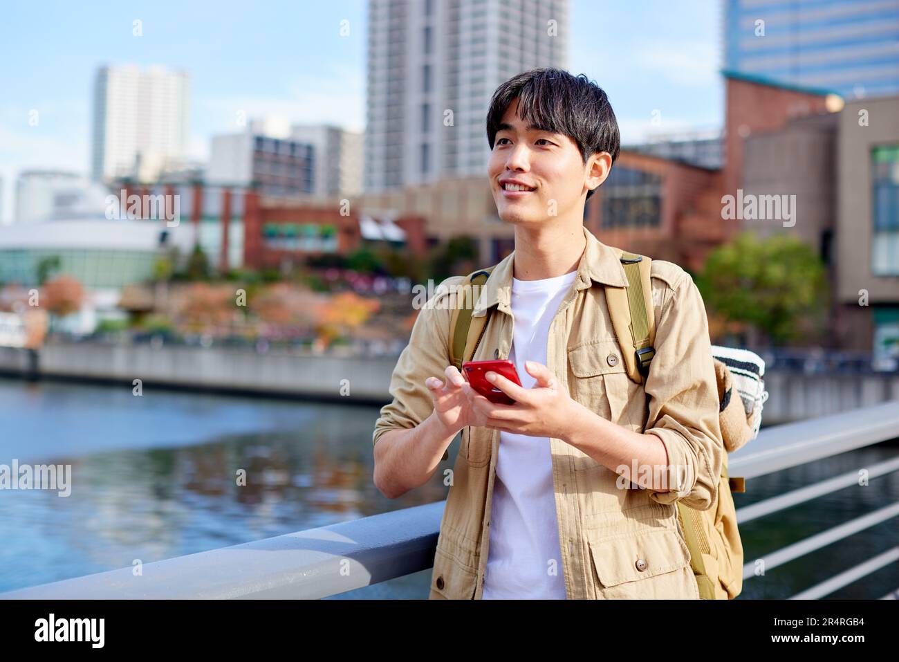 Young Japanese man travelling Stock Photo - Alamy
