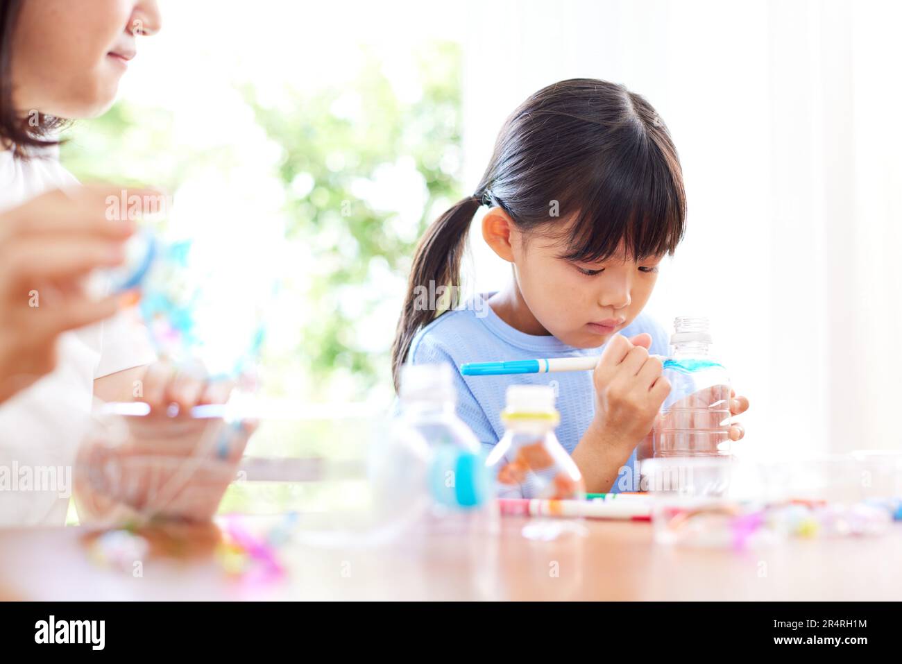 Japanese kid doing arts and crafts Stock Photo - Alamy