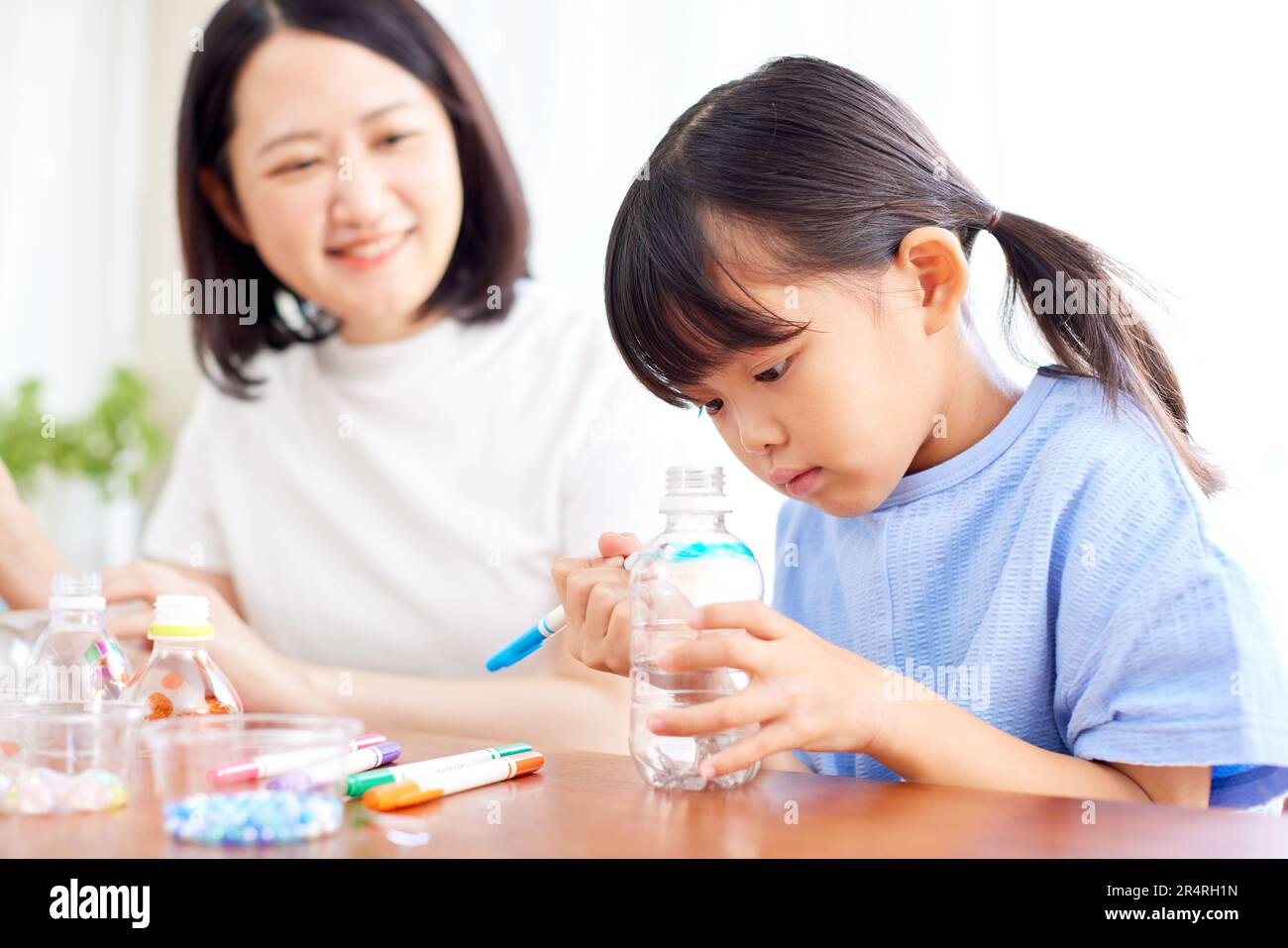 Japanese kid doing arts and crafts Stock Photo - Alamy
