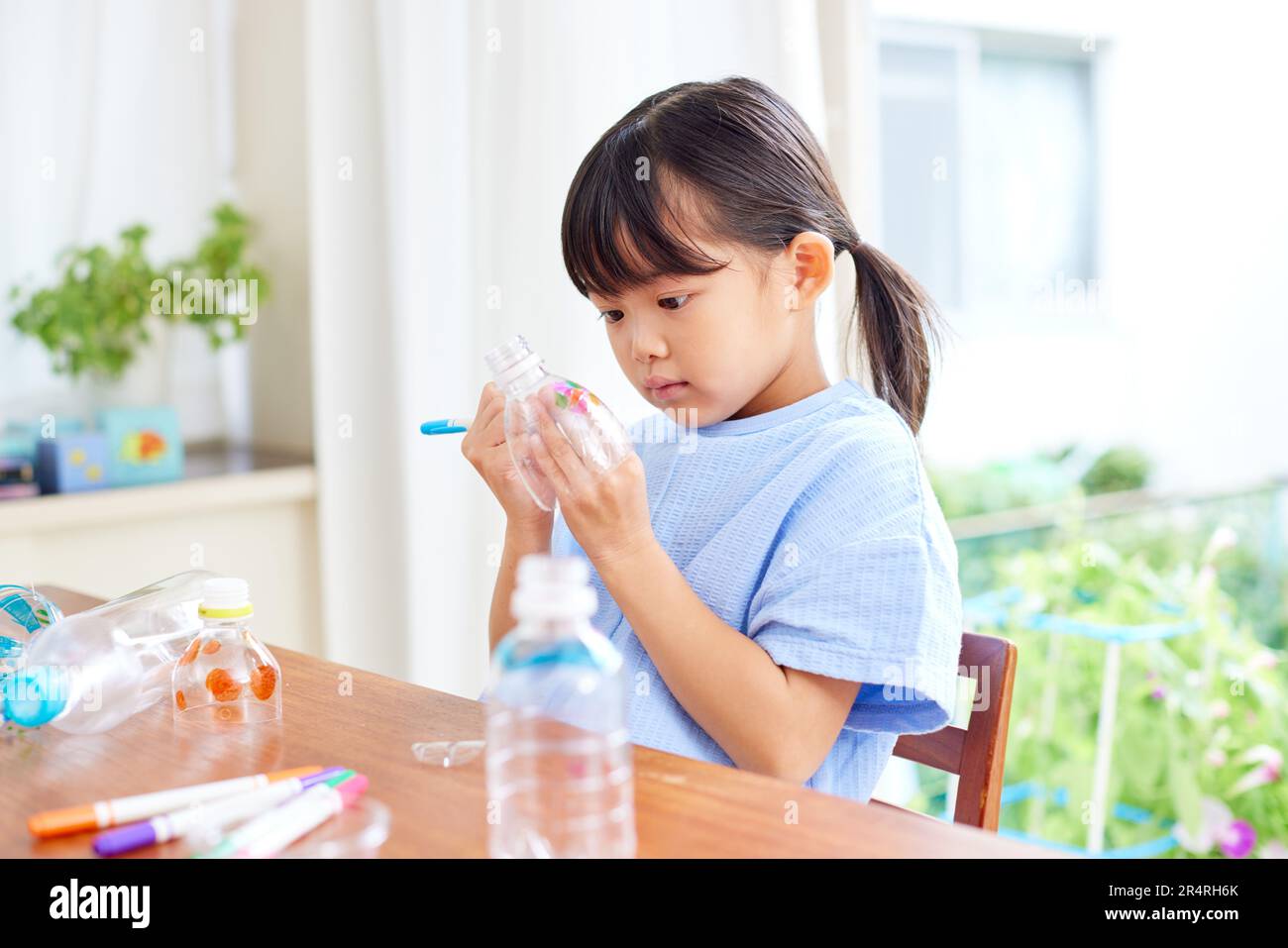 Japanese kid doing arts and crafts Stock Photo - Alamy