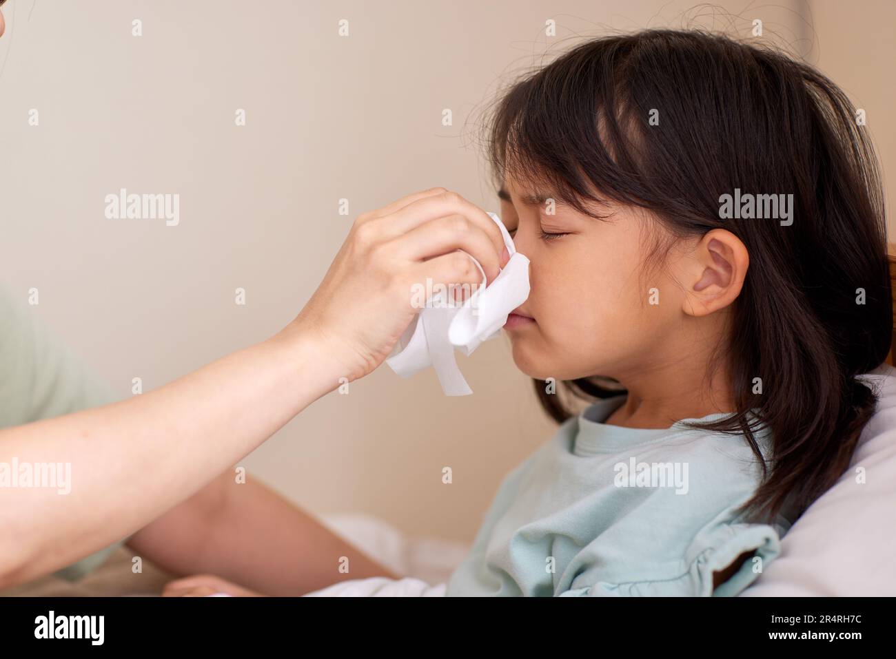 Japanese kid sick in bed Stock Photo - Alamy