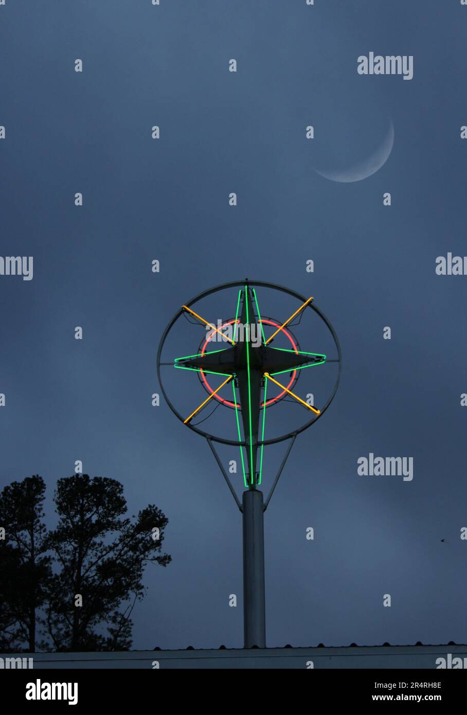 Vintage Neon Sign on Roof of Building With Moon in Background Rural ...