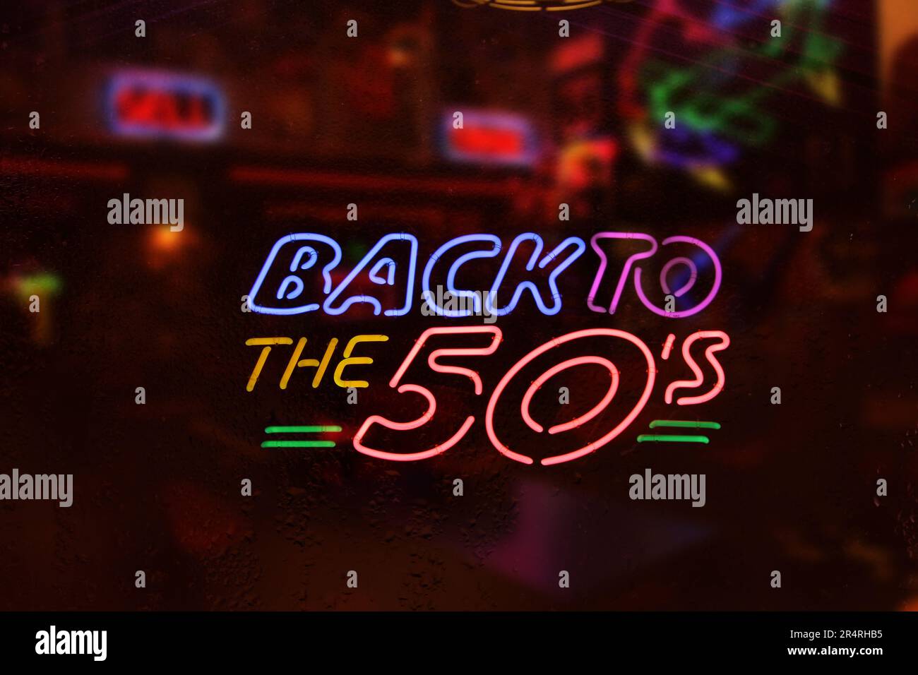 Vintage Neon Back to the 50s Sign in Rainy Restaurant Window Stock ...