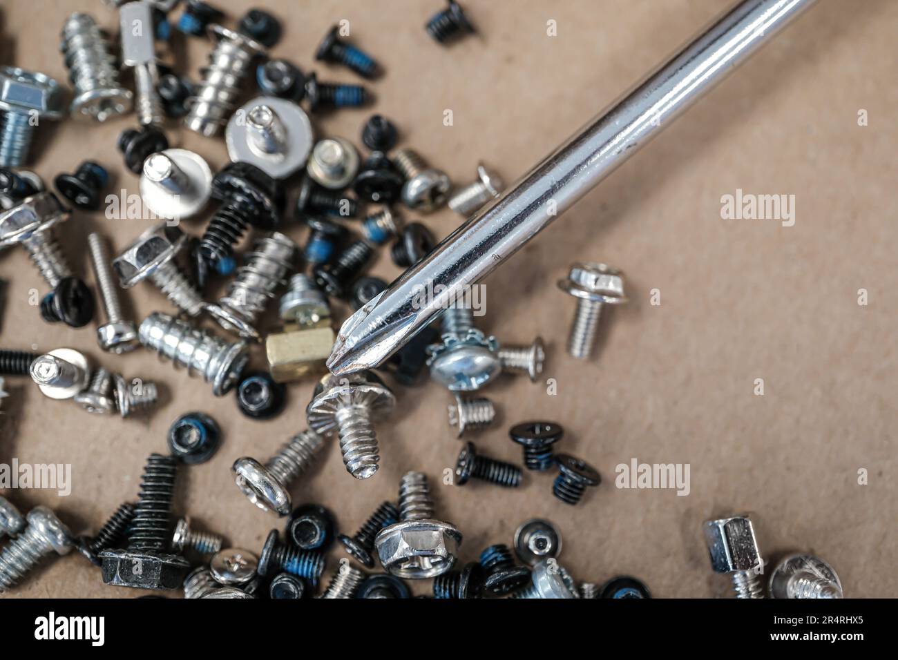 pile of screws and nuts for servicng electronics Stock Photo - Alamy