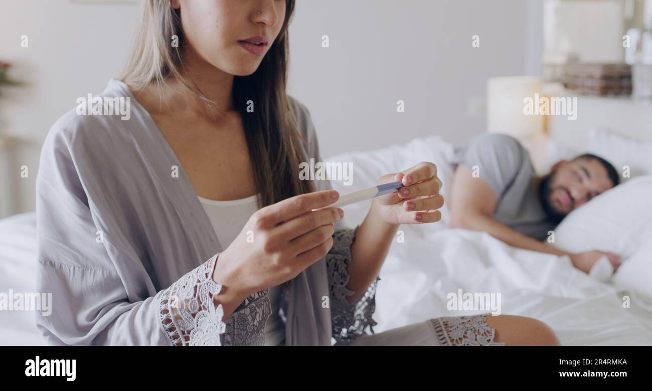 Woman, pregnancy test and bedroom with man, sad and stress for results ...