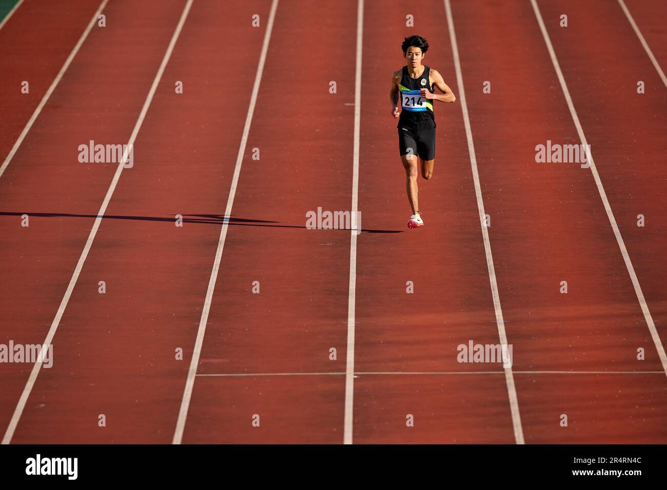 Japanese athletes running on track Stock Photo - Alamy